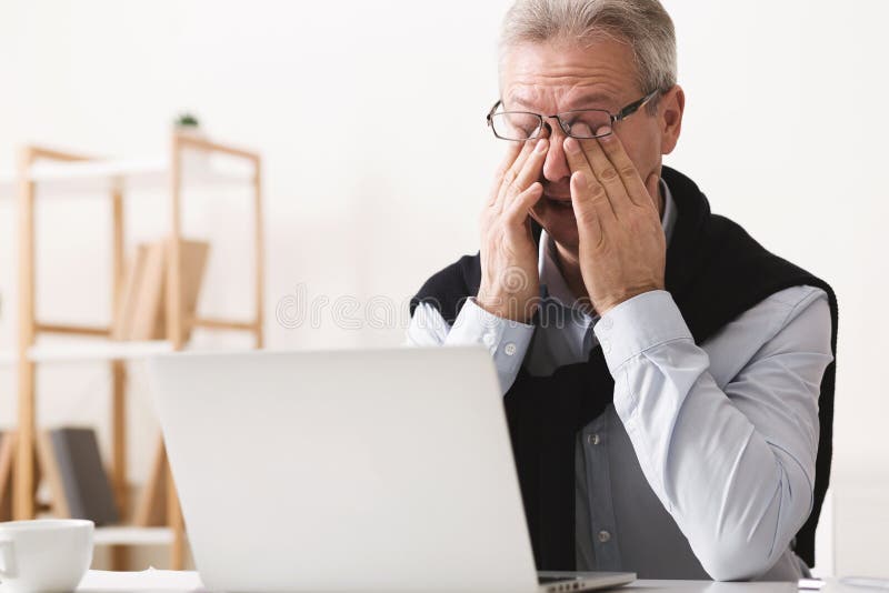 Hard Day. Elderly Man Feeling Tired, Working on Laptop Stock Photo ...