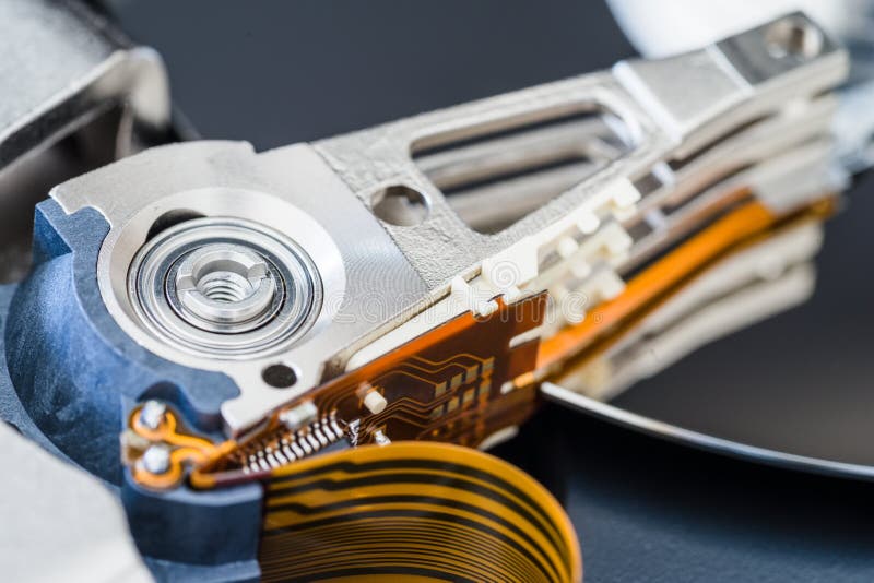 Hard Disk Drive Inside Close-up, Actuator Arm, Read Write Head, Ribbon ... Hard Disk Drive Inside Close-up, Actuator Arm, Read Write Head, Ribbon ...