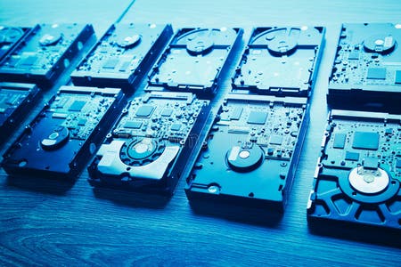 Hard disk drives in a rows stock image. Image of capacity - 82918761