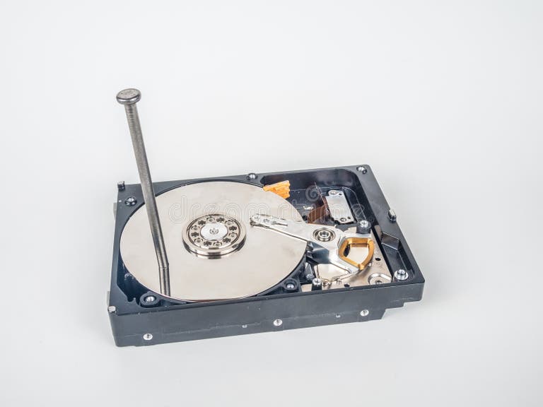 Hard disk with the nail stock photo. Image of inside - 80297142