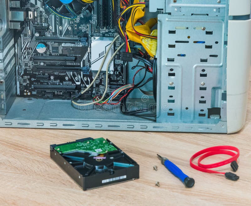 Hard Disk, Screwdriver and Sata Cable by a Computer Stock Photo - Image ...