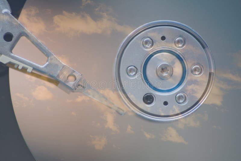 Hard drive and clouds stock image. Image of data, disk - 2427707