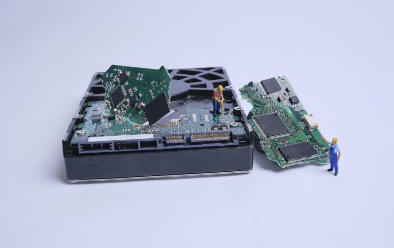 Hard Drive Defective with Two Model Figures Worker Stock Photo - Image ...