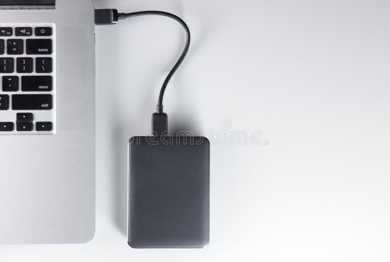 Hard drive and laptop stock photo. Image of storage - 183779002