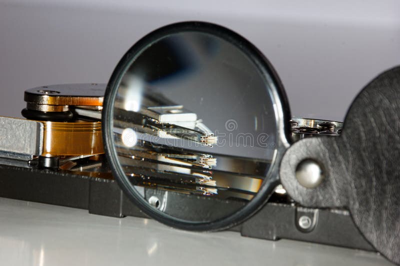 Hard Drive and Magnifying Glass, Representing the Process of Searching ...