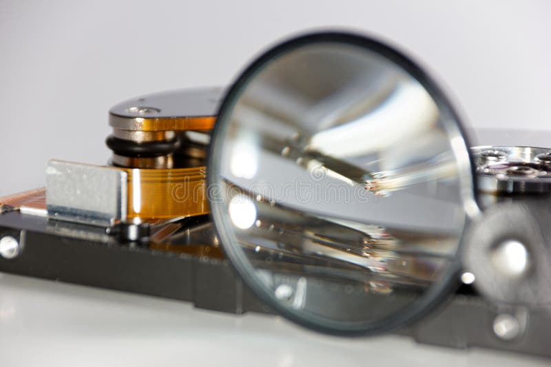 Hard Drive and Magnifying Glass, Representing the Process of Searching ...