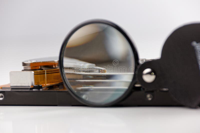 Hard Drive and Magnifying Glass, Representing the Process of Searching ...