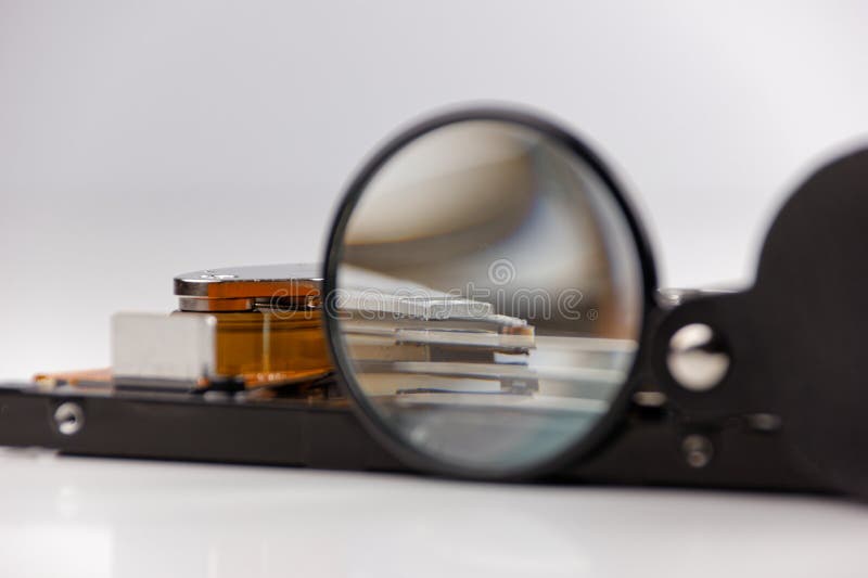 Hard Drive and Magnifying Glass, Representing the Process of Searching ...