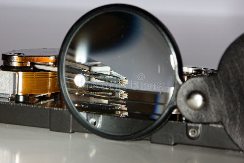 Hard Drive and Magnifying Glass, Representing the Process of Searching ...