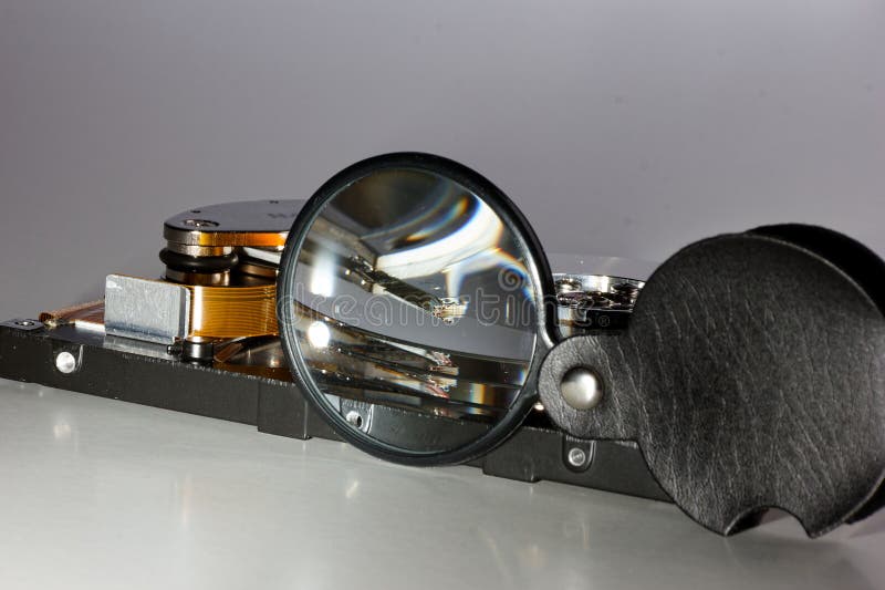 Hard Drive and Magnifying Glass, Representing the Process of Searching ...