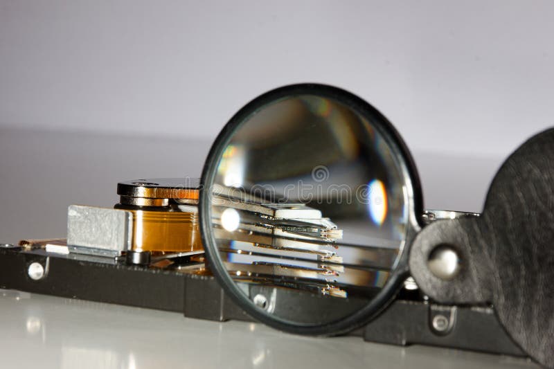 Hard Drive and Magnifying Glass, Representing the Process of Searching ...