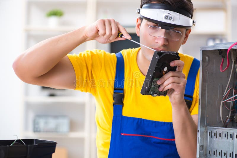 The Hard Drive Repair and Data Recovery Specialist Working in Lab Stock ...