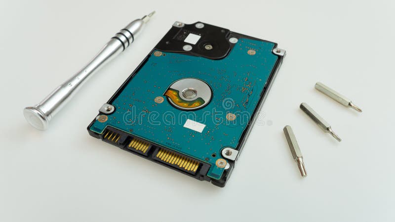 Hard Drive and Repair Tools Lie on a White Table. Computer Repair ...