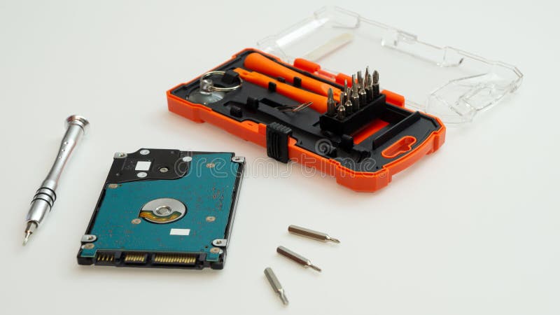 Hard Drive and Repair Tools Lie on a White Table. Computer Repair ...