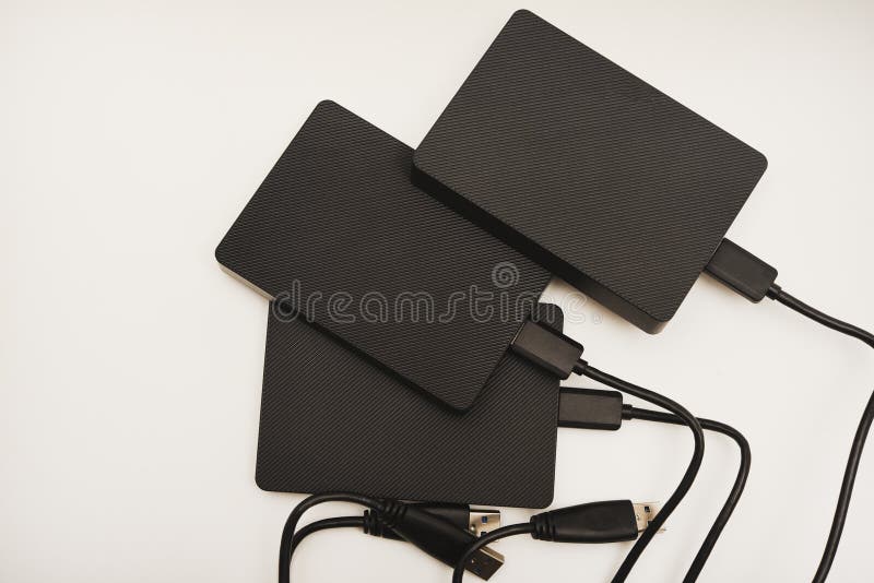 Hard Drives on a White Background. Modern Data Storage Devices with USB ...