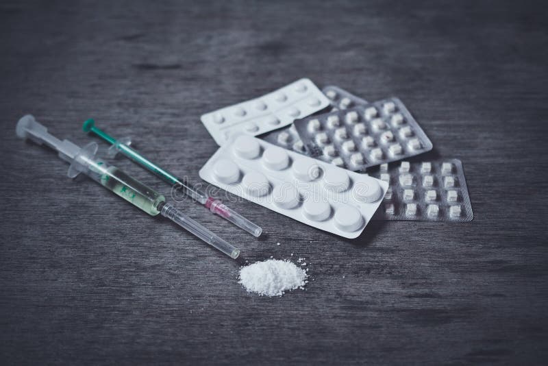 Hard drugs on dark table stock image. Image of lighter - 83552591