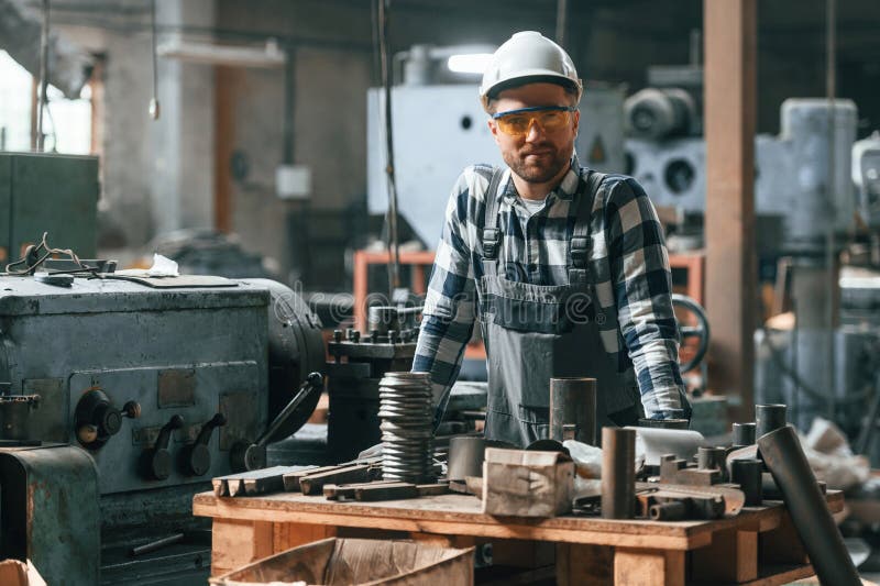 In Hard Hat. Factory Male Worker in Uniform is Indoors Stock Photo ...