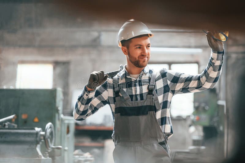 In Hard Hat. Factory Male Worker in Uniform is Indoors Stock Photo ...