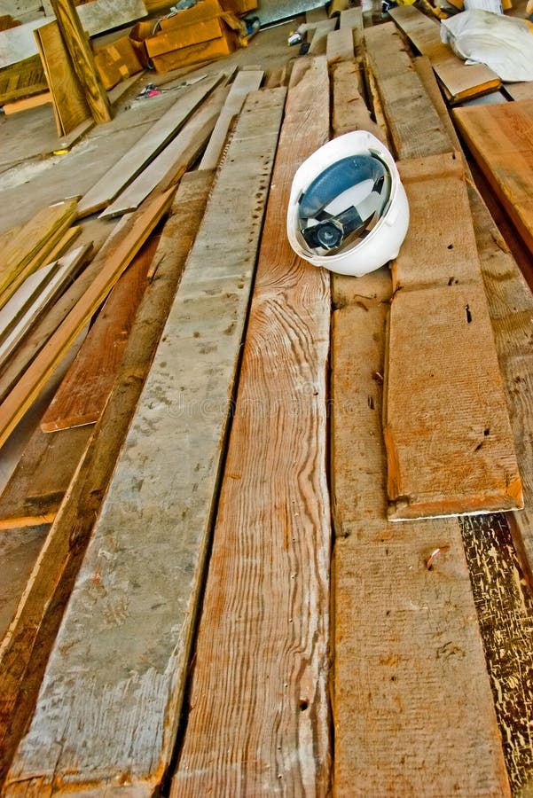A hard hat on wood planks stock photo. Image of hard - 12881420