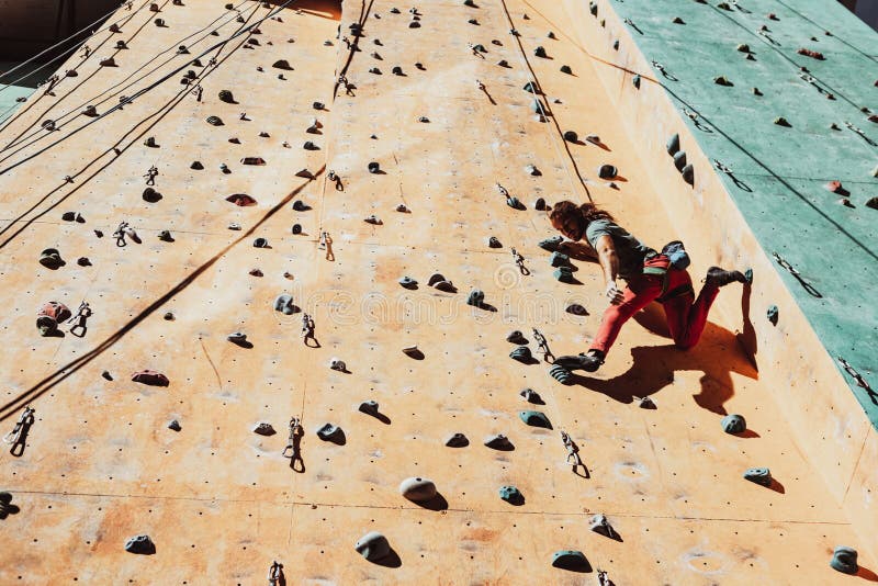 Hard Level. Young Man Professional Rock Climber Practicing at Training ...
