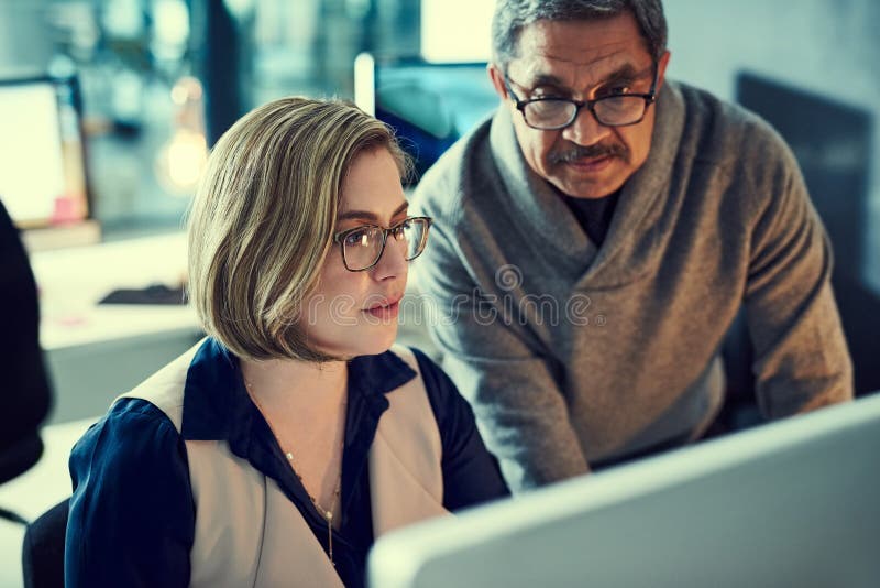 Hard Work is the Baseline for Success. Two Businesspeople Working Late ...