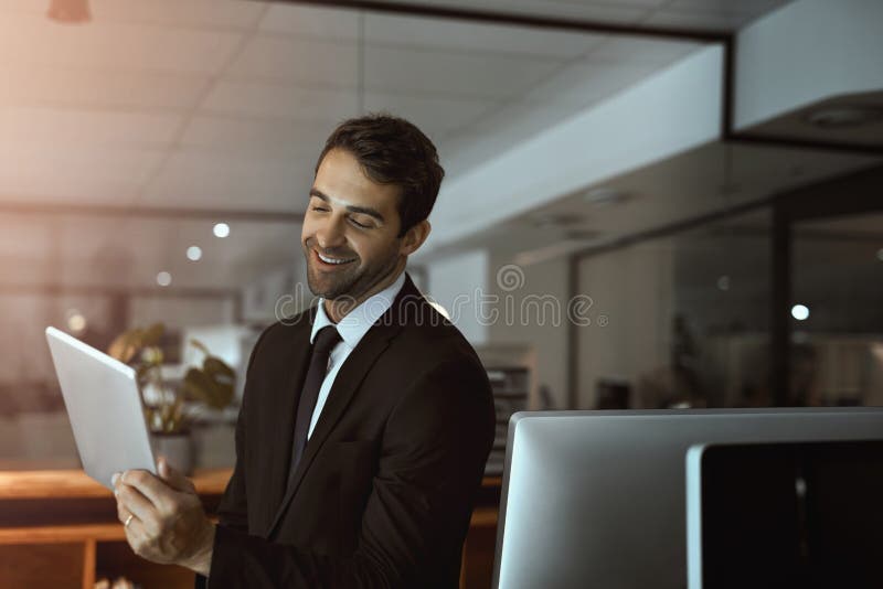 Hard Work is a Basic Requirement for Success. a Young Businessman Using ...