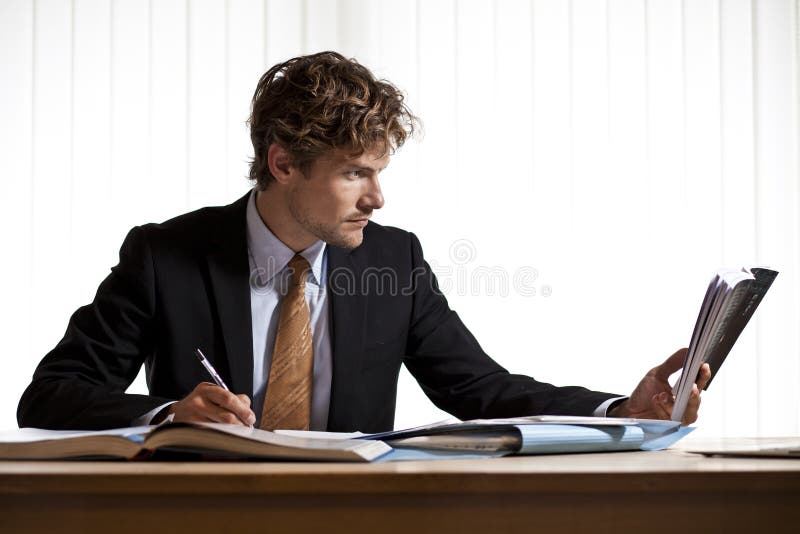 Hard at work businessman stock image. Image of adult - 32973543