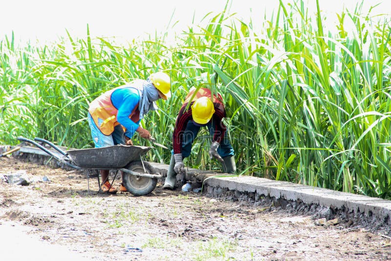 Hard Work of a Construction Worker Regardless of Weather and Time ...