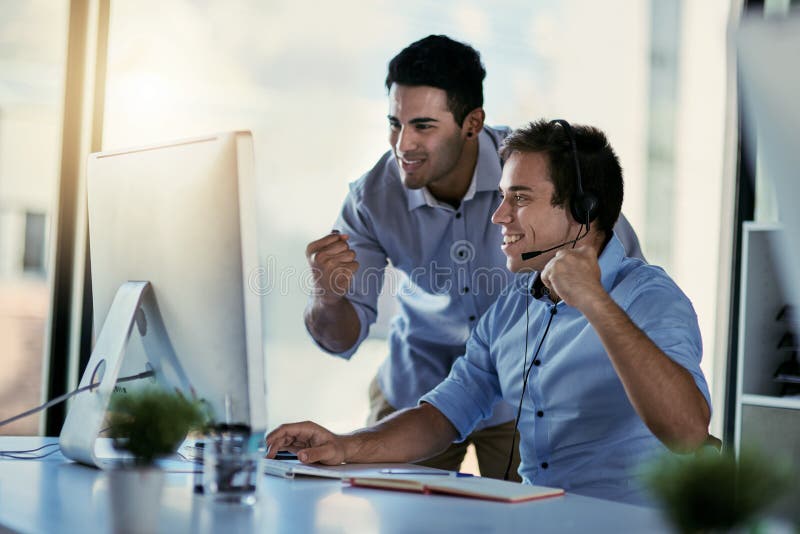 Hard Work Does Indeed Pay Off. Two Call Centre Agents Doing a Fist Pump ...