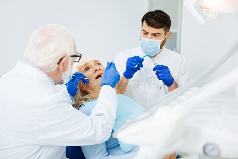 Skilled Dentists Curing the Patient Stock Photo - Image of dent ...