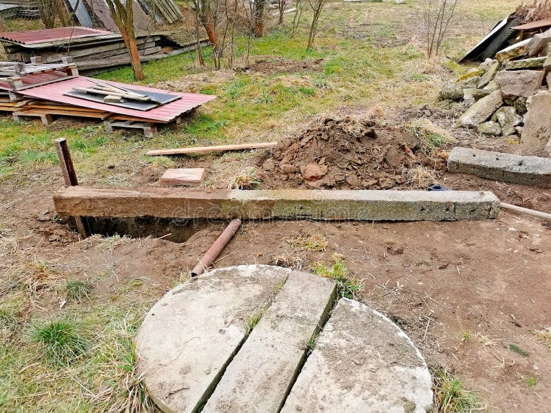 Hard Work in the Garden, Pulling a Concrete Post Out of the Ground ...
