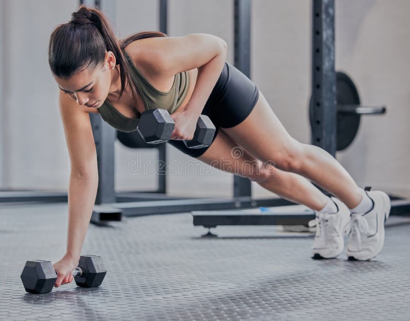 Hard Work Gets Hard Muscles. a Young Woman Working Out with Weights in a Gym. Stock Photo ...