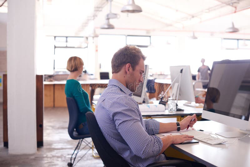Hard at Work. a Handsome Young Man Working in His Office. Stock Image ...