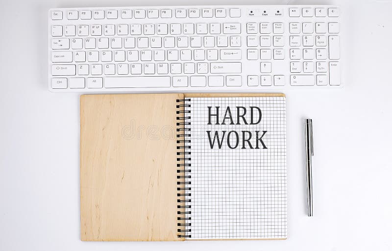 HARD WORK Text on the Notebook with Keyboard on White Background Stock ...