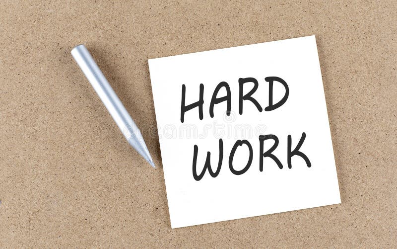HARD WORK Text on Sticky Note on a Cork Board with Pencil Stock Photo ...