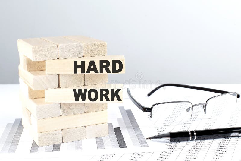 HARD WORK is Written on Wooden Blocks on a Chart Background Stock Photo ...