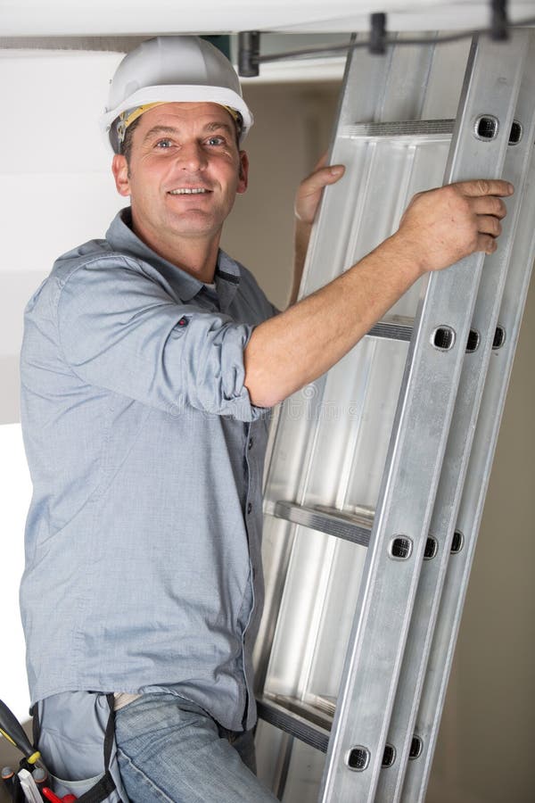 Hard Worker Man in Ladder Smiling at Camera Stock Image - Image of ...
