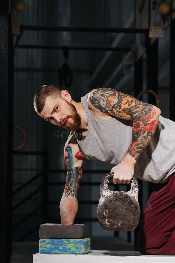 Hard-working Armless Man Doing Bent Over Single Arm Back Row with a ...