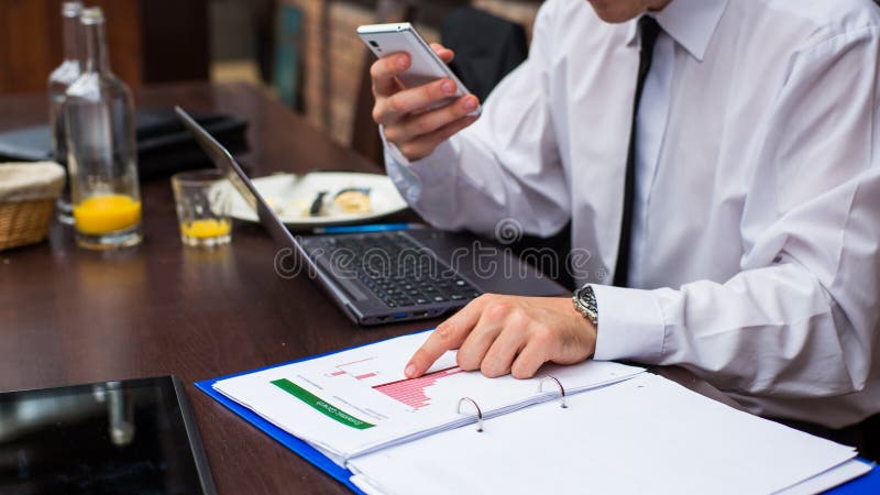 Hard Working Businessman in Restaurant. Stock Photo - Image of ...