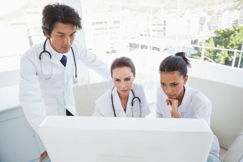 Doctor Reviewing Chart Of Patient About To Have Mri Scan Stock Image ...