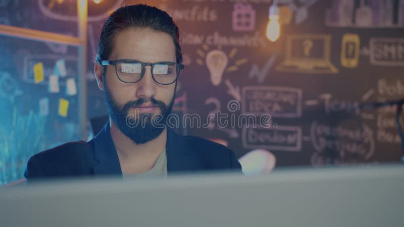 Hard-working Employee Using Computer Looking at Monitor Sitting in Dark ...