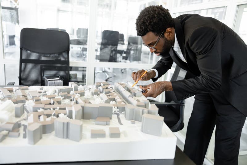 Hard Working Man Architect Conceptualizing New Exterior Designs in the ...