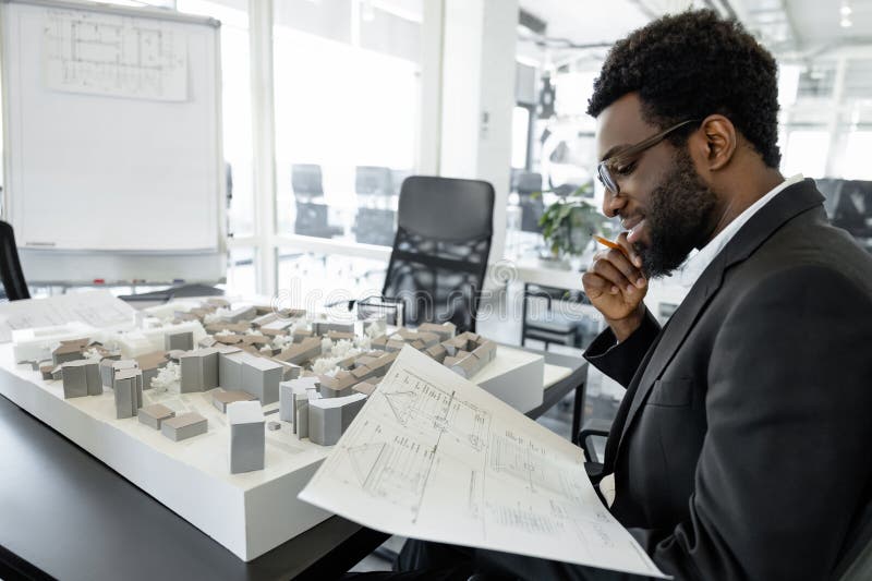 Hard Working Man Architect Conceptualizing New Exterior Designs in the ...