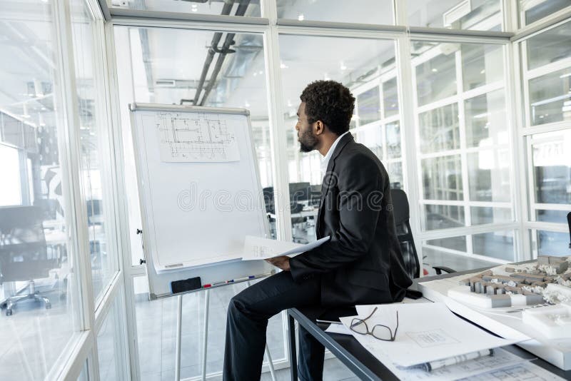 Hard Working Man Architect Conceptualizing New Exterior Designs in the ...