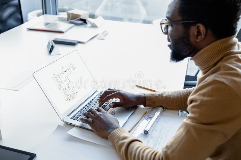 Hard Working Man Architect Handling Creative Projects on Laptop in the ...