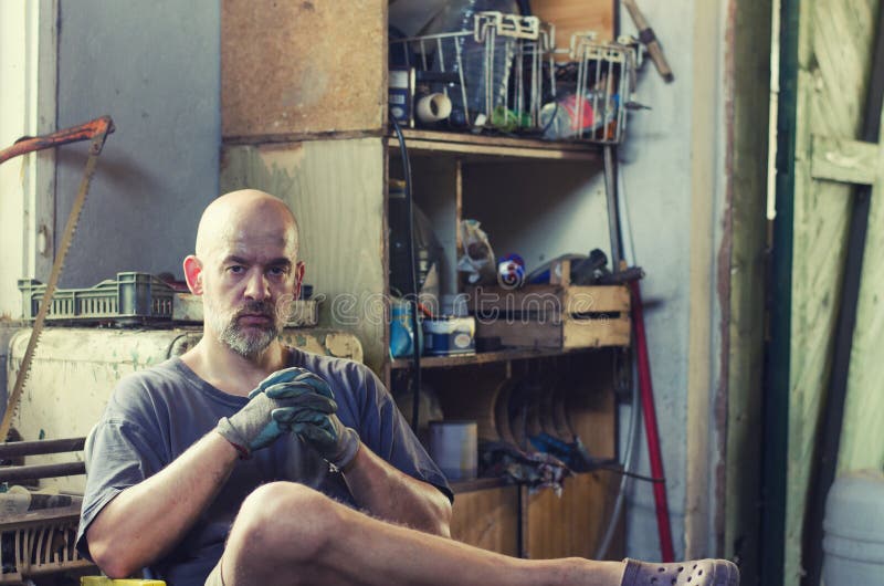 Hard Working Man Sitting in His Workshop Stock Photo - Image of working ...