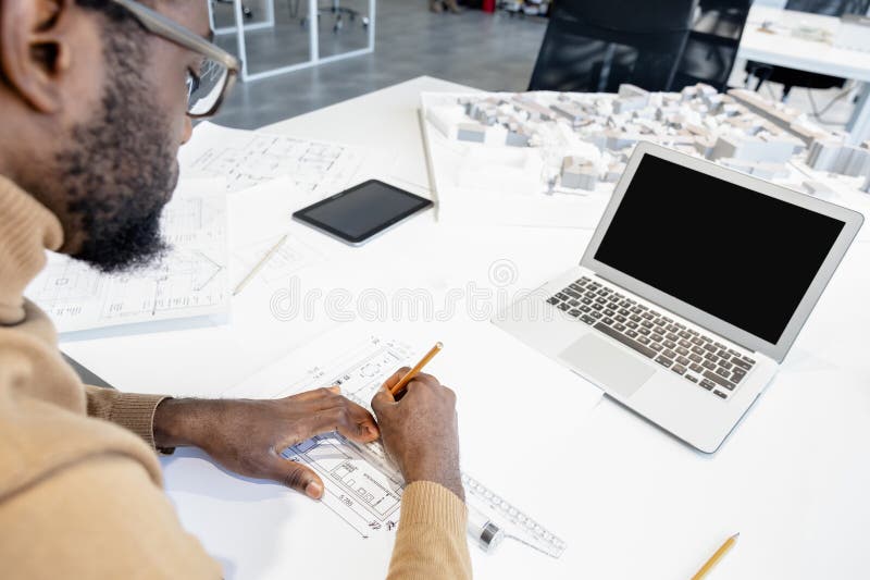 Hard Working Man Architect Handling Creative Projects on Laptop in the ...