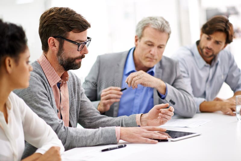 Hard Working Office Pros. Shot of a Group of Young Professionals ...