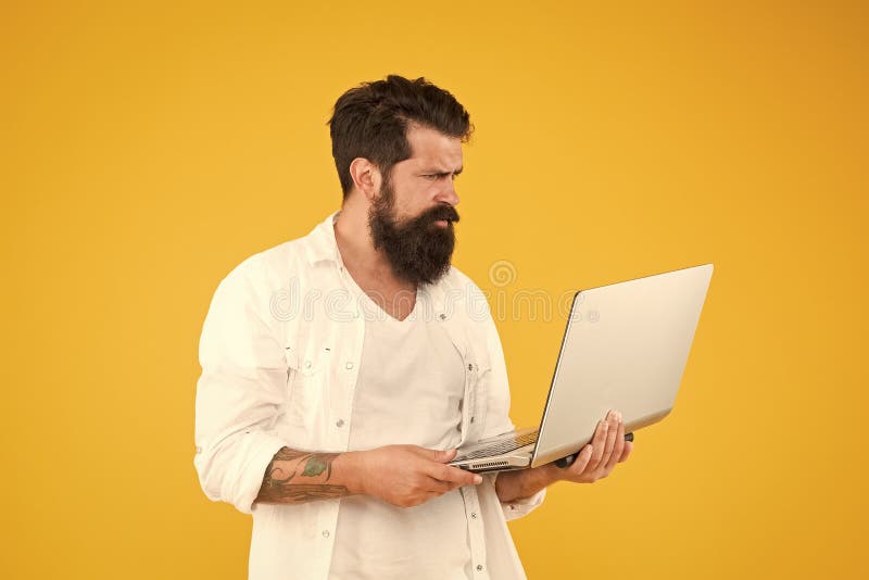 Hard Working. Programmer with Computer. Brutal Man Surfing Internet ...