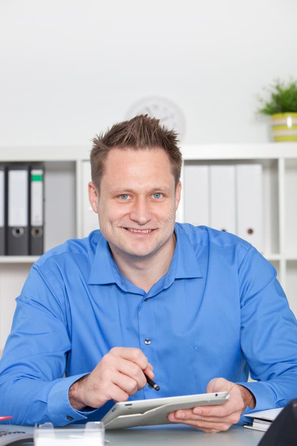 Hard Working Young Businessman at His Desk Stock Photo - Image of desk ...